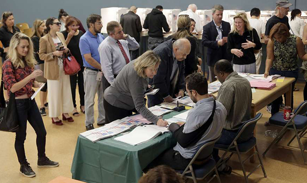Long hours, low pay, but Arizona poll workers are still signing up ...
